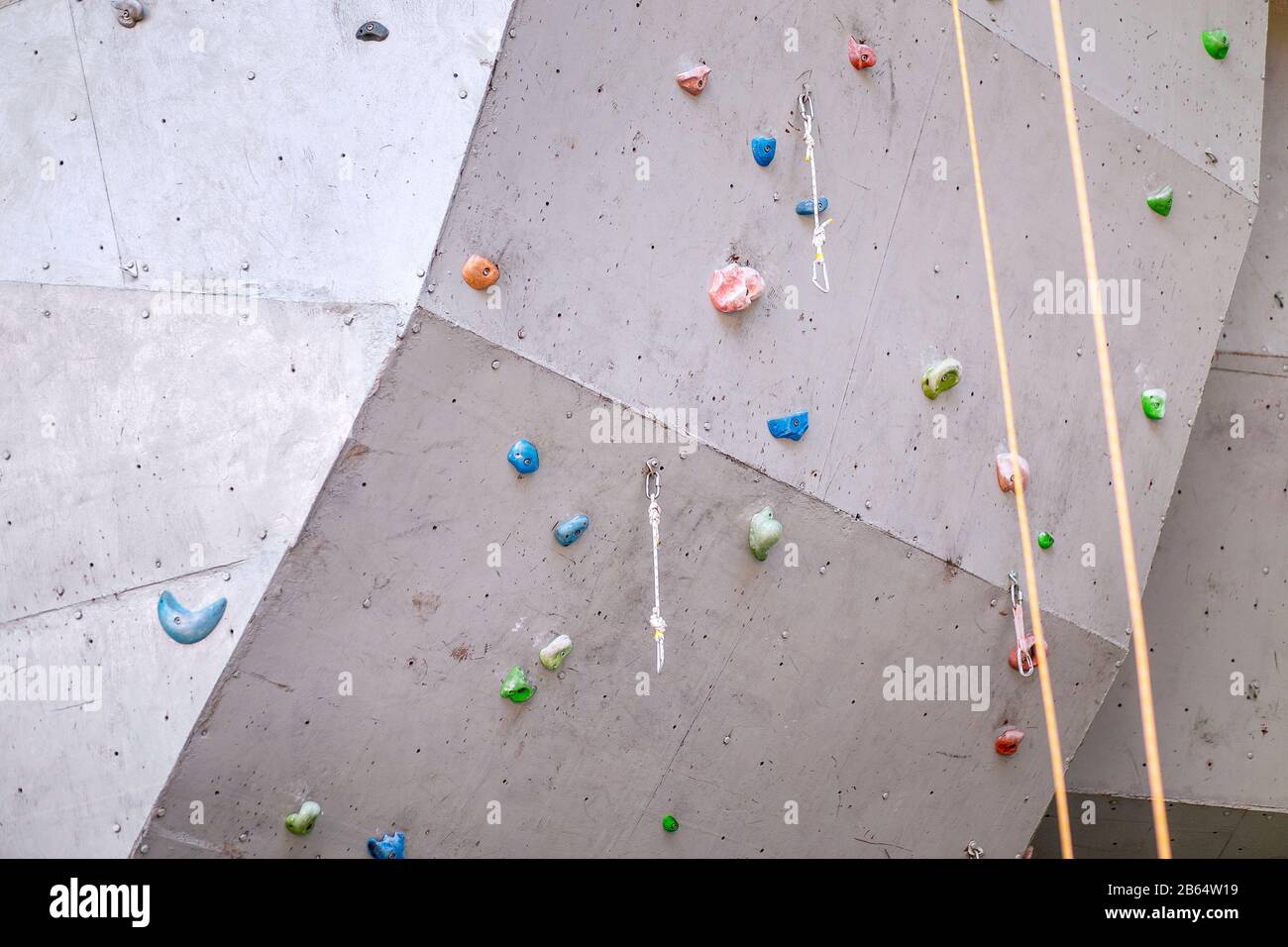 climbing wall with rope, carabiner and hooks Stock Photo - Alamy