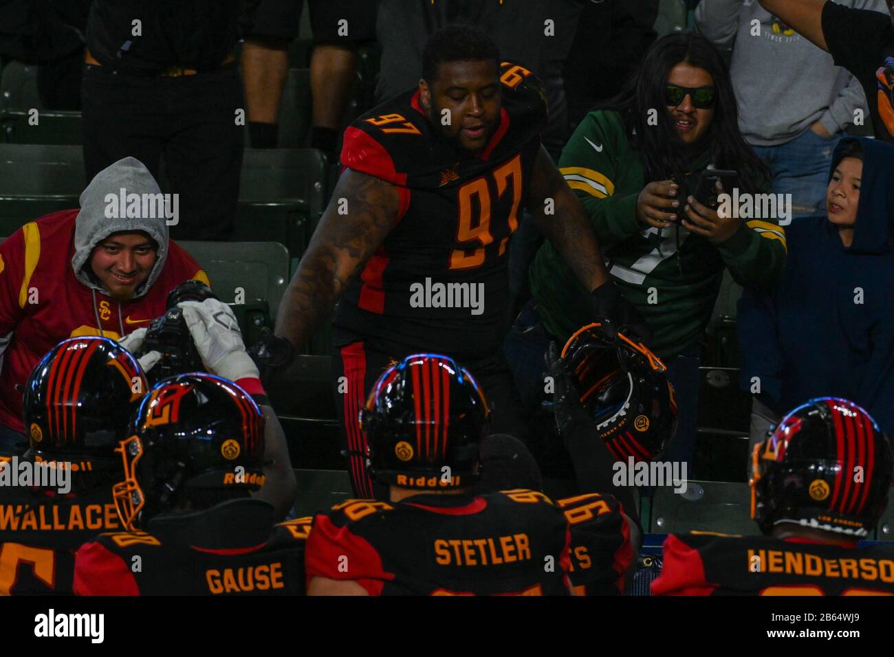 LA Wildcats defensive tackle Reggie Howard (97) celebrates with fans ...