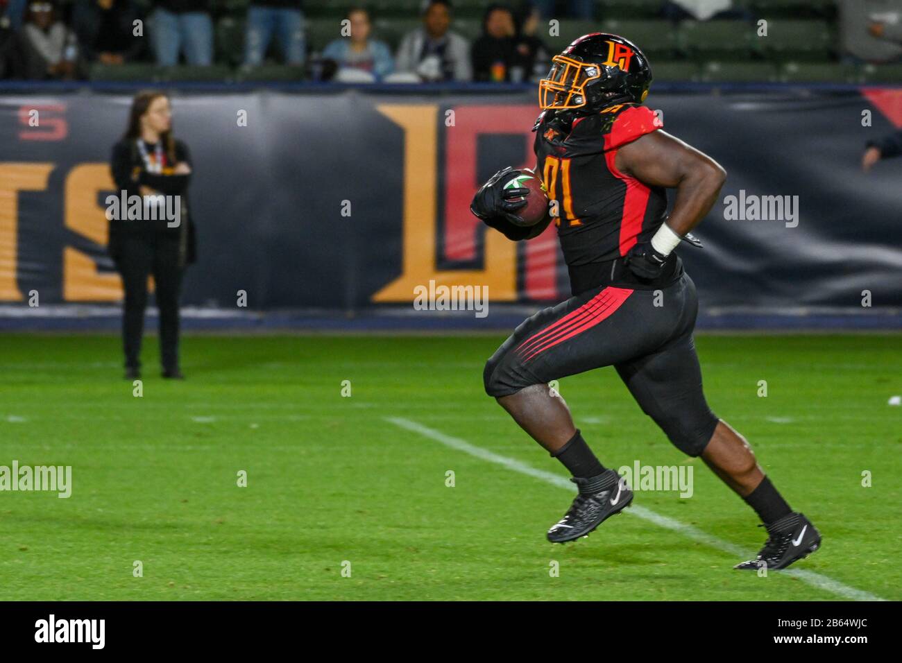 LA Wildcats defensive tackle Boogie Roberts (91) runs the ball in for a ...
