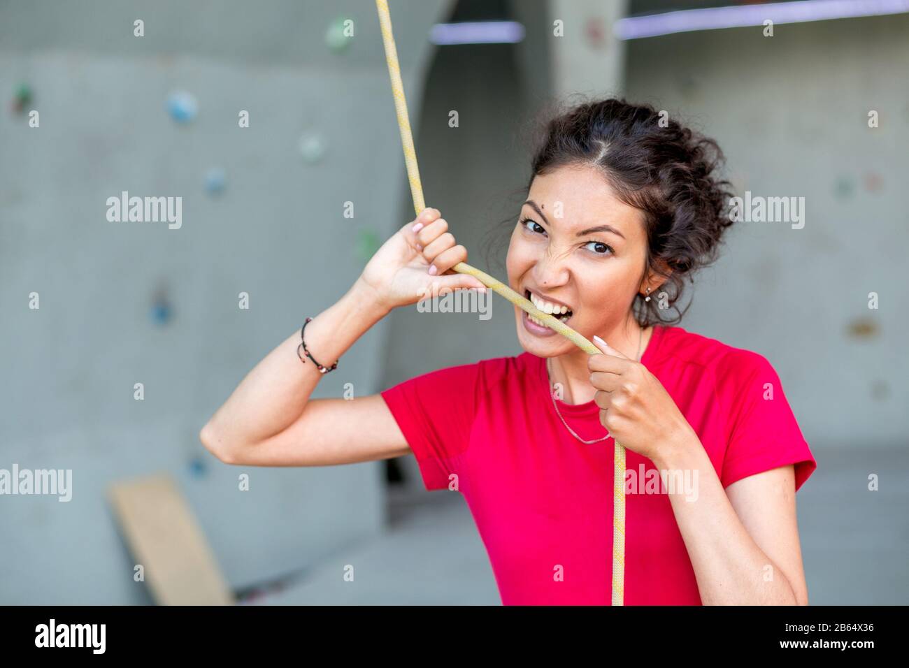 Girl bites the rope Stock Photo - Alamy