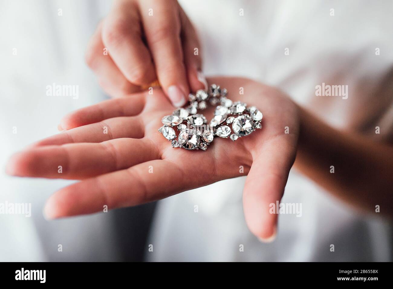 Female hands holding box rings hi-res stock photography and images - Alamy