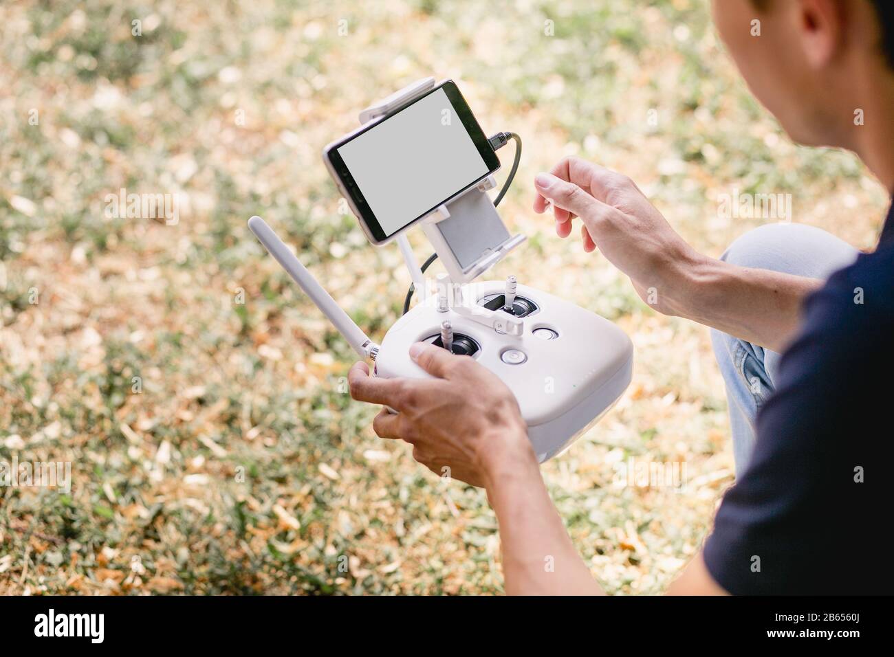 the remote control quadcopter with the operator and smartphone Stock ...