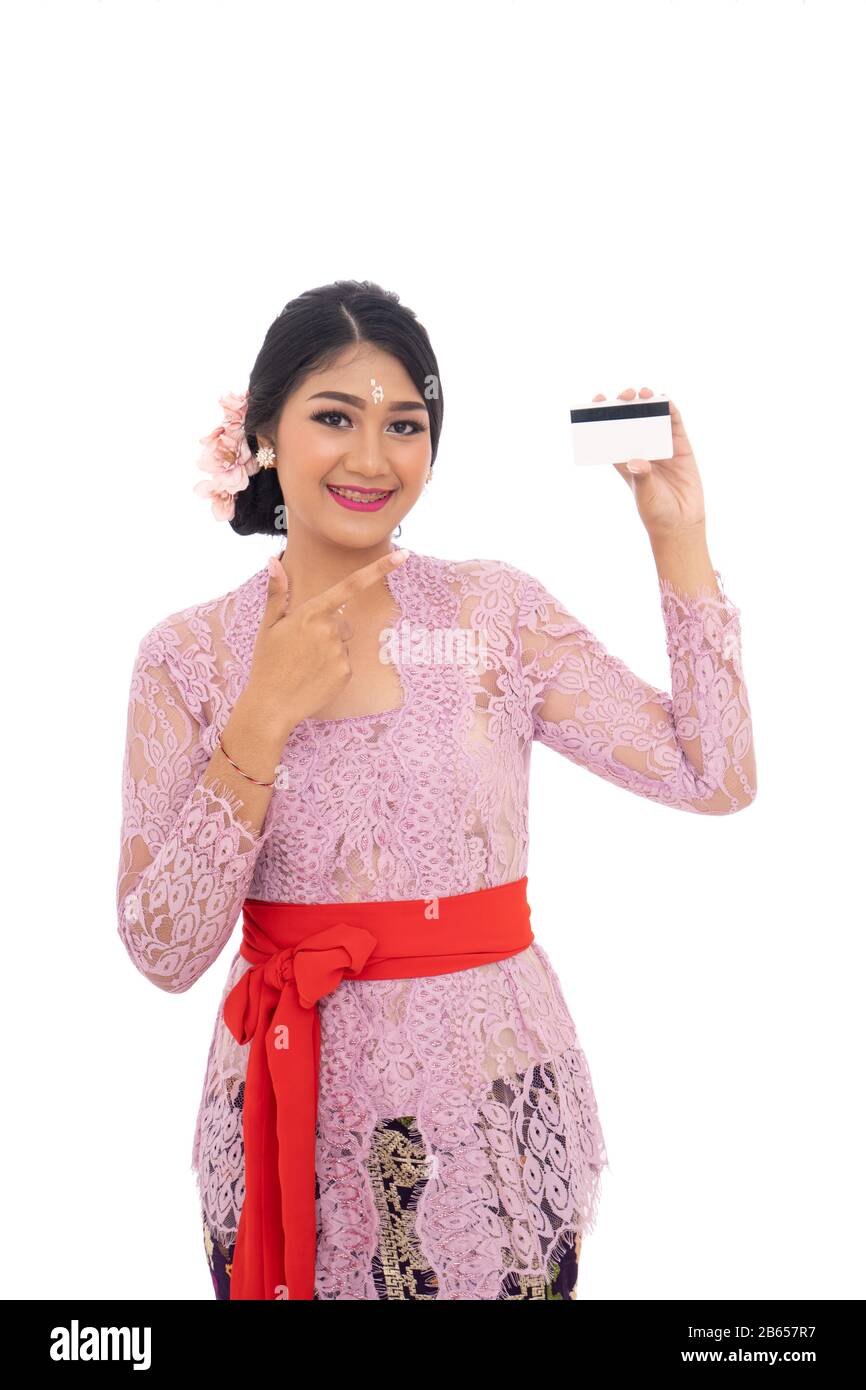 Young beautiful woman wears traditional Balinese clothes holding credit ...