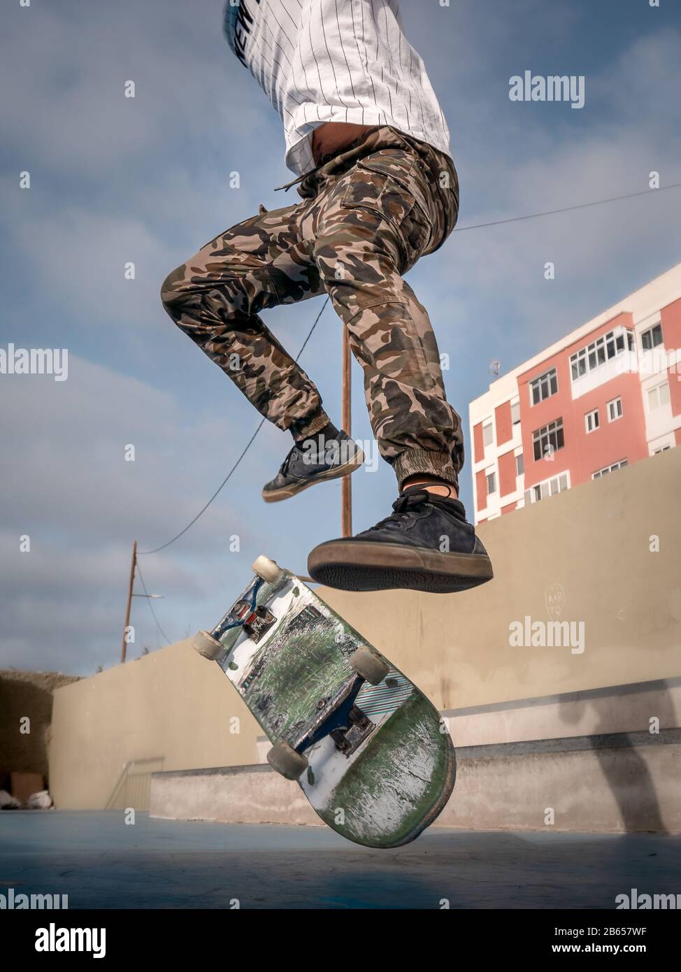 closeup of the legs of a skateboarder about to fall off the board when ...