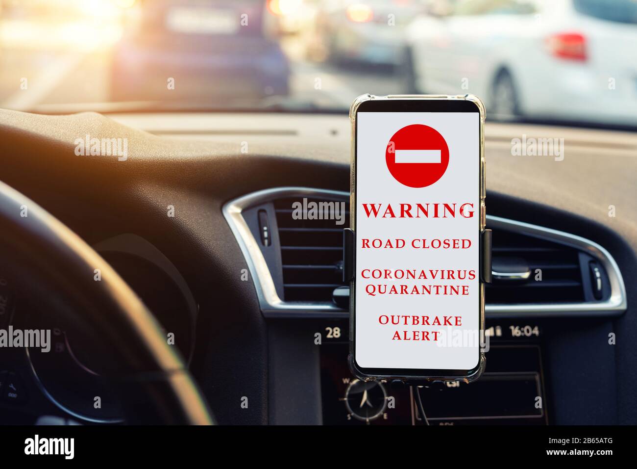 Modern smartphone device gadget mounted phone holder at car dashboard ...