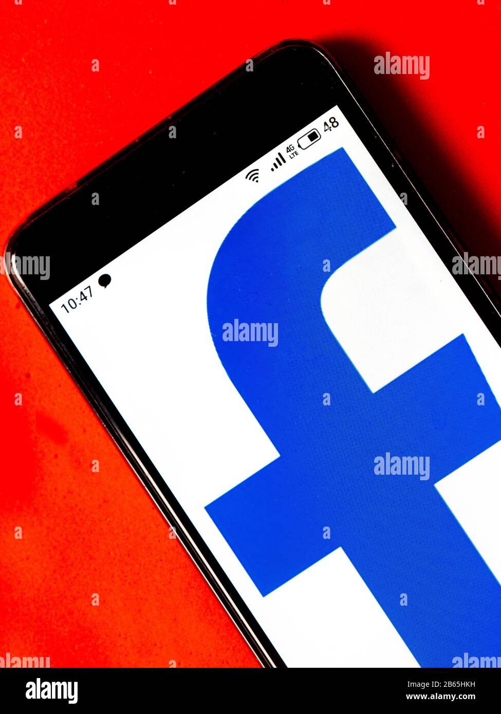 In this photo illustration the Facebook logo is seen displayed on a ...