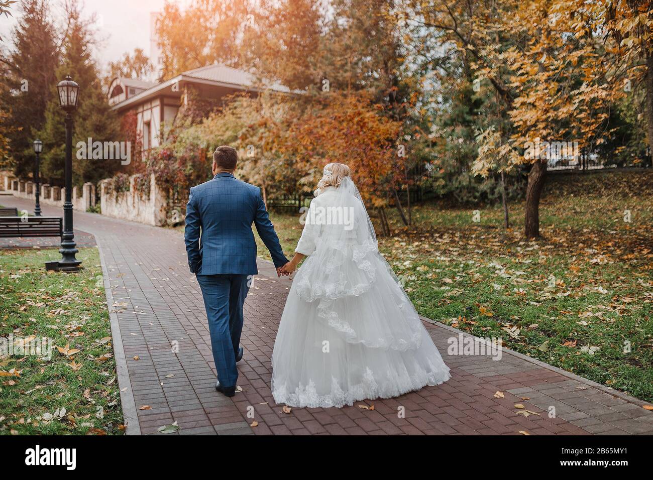 Married wedding couple walking away hi-res stock photography and images ...