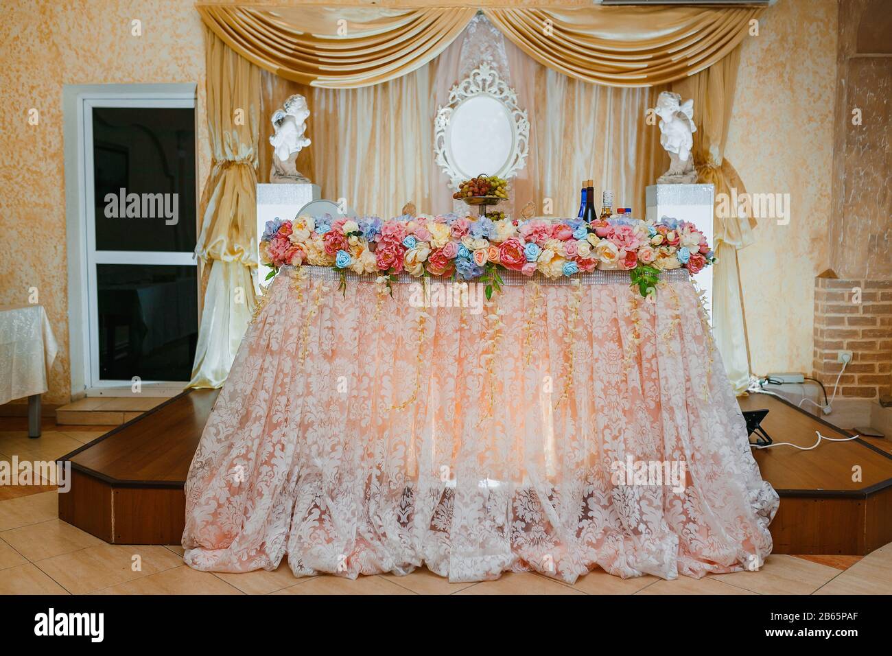 Decoration of a wedding presidium table at the banquet in pastel color ...