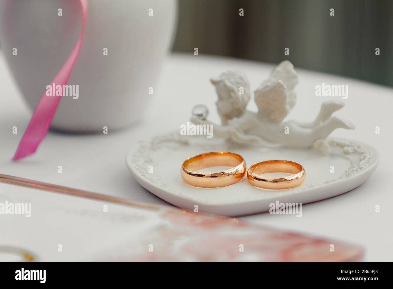 Wedding Register table with Pen, Bride and Groom Rings Stock Photo - Alamy