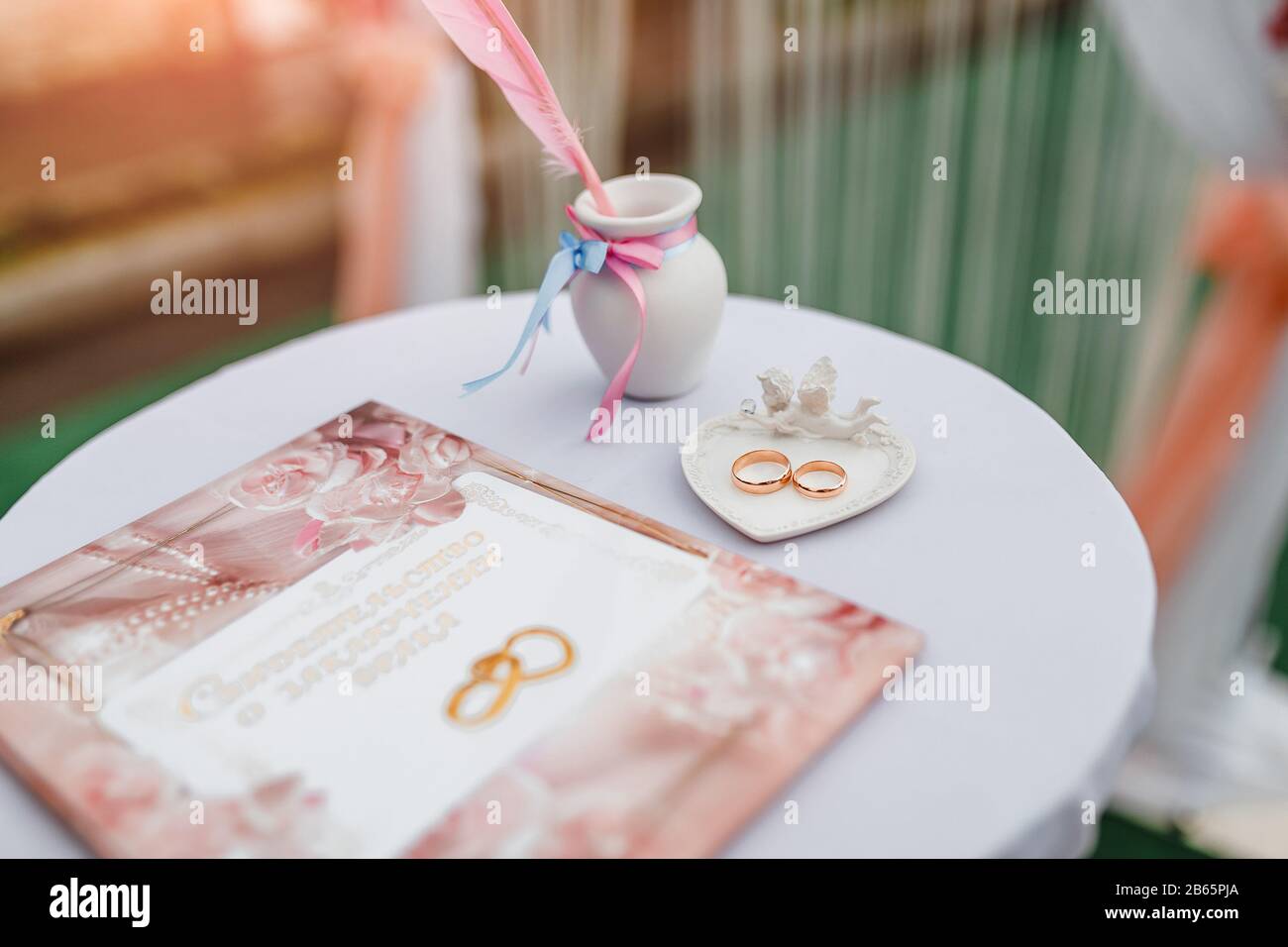 Wedding Register table with Pen, Bride and Groom Rings Stock Photo - Alamy