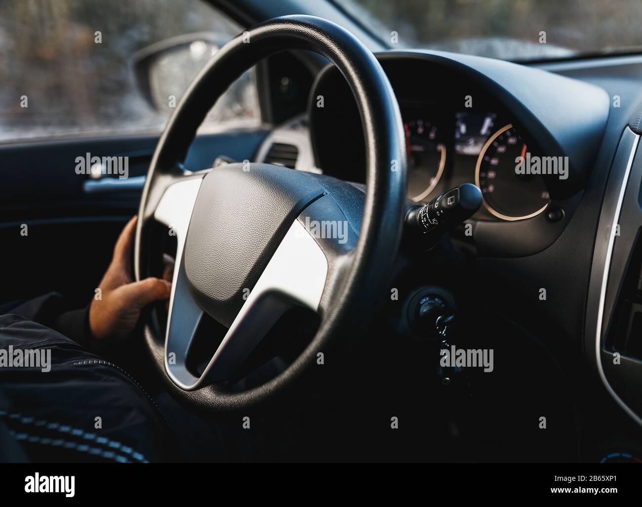 hand on steering wheel close up of a man driving a car Stock Photo - Alamy