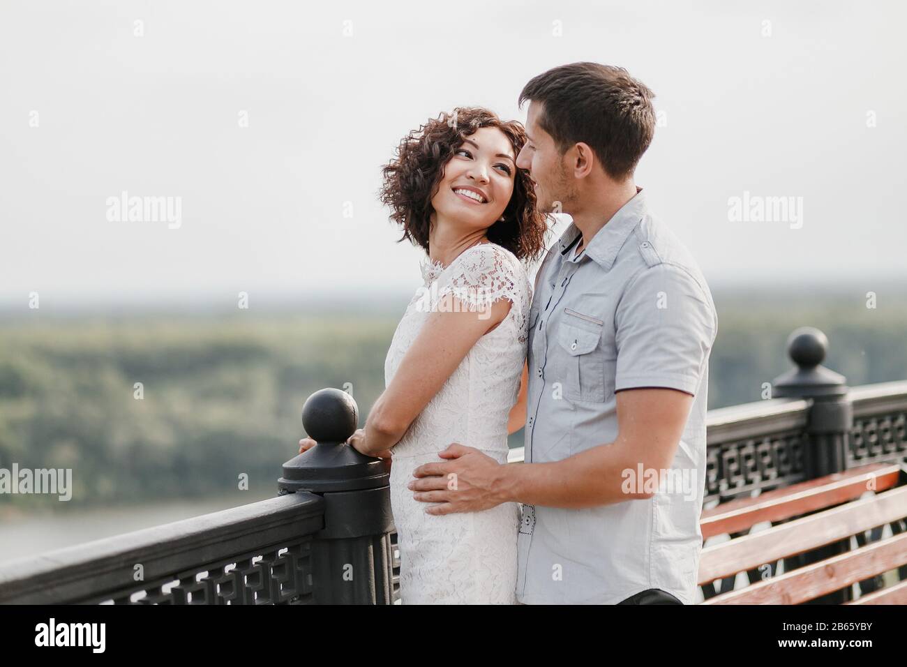 happy smiling couple walking and hugging in the park Stock Photo - Alamy