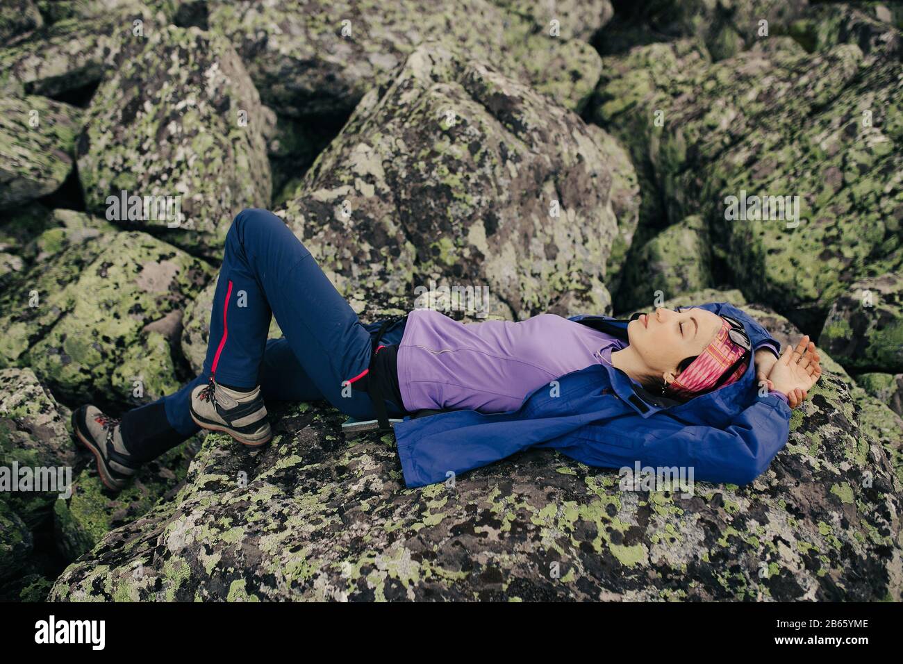 Women hiker lying on the rock in Ural mountain Stock Photo - Alamy