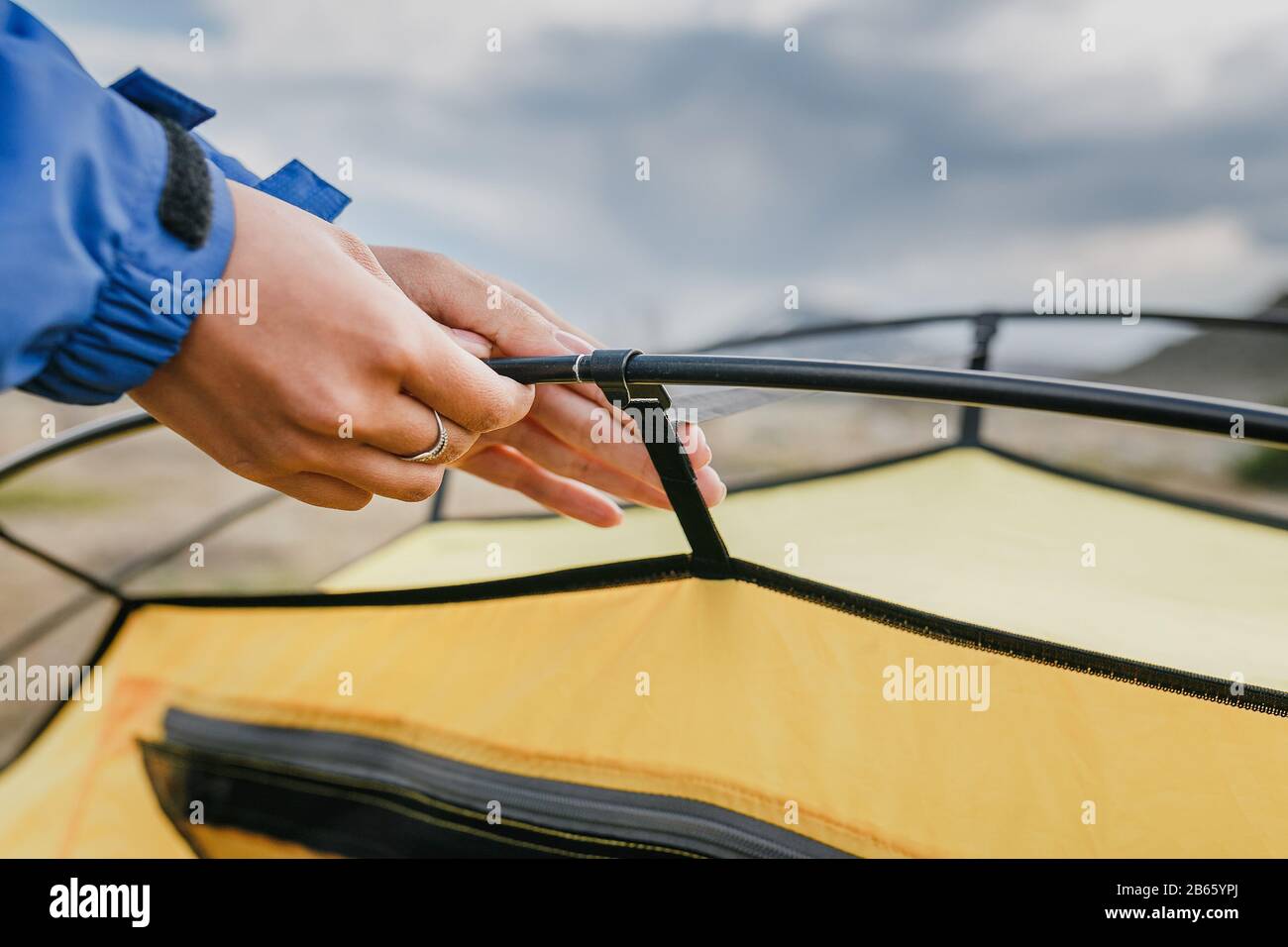 setting the tent up, female hands close-up Stock Photo - Alamy