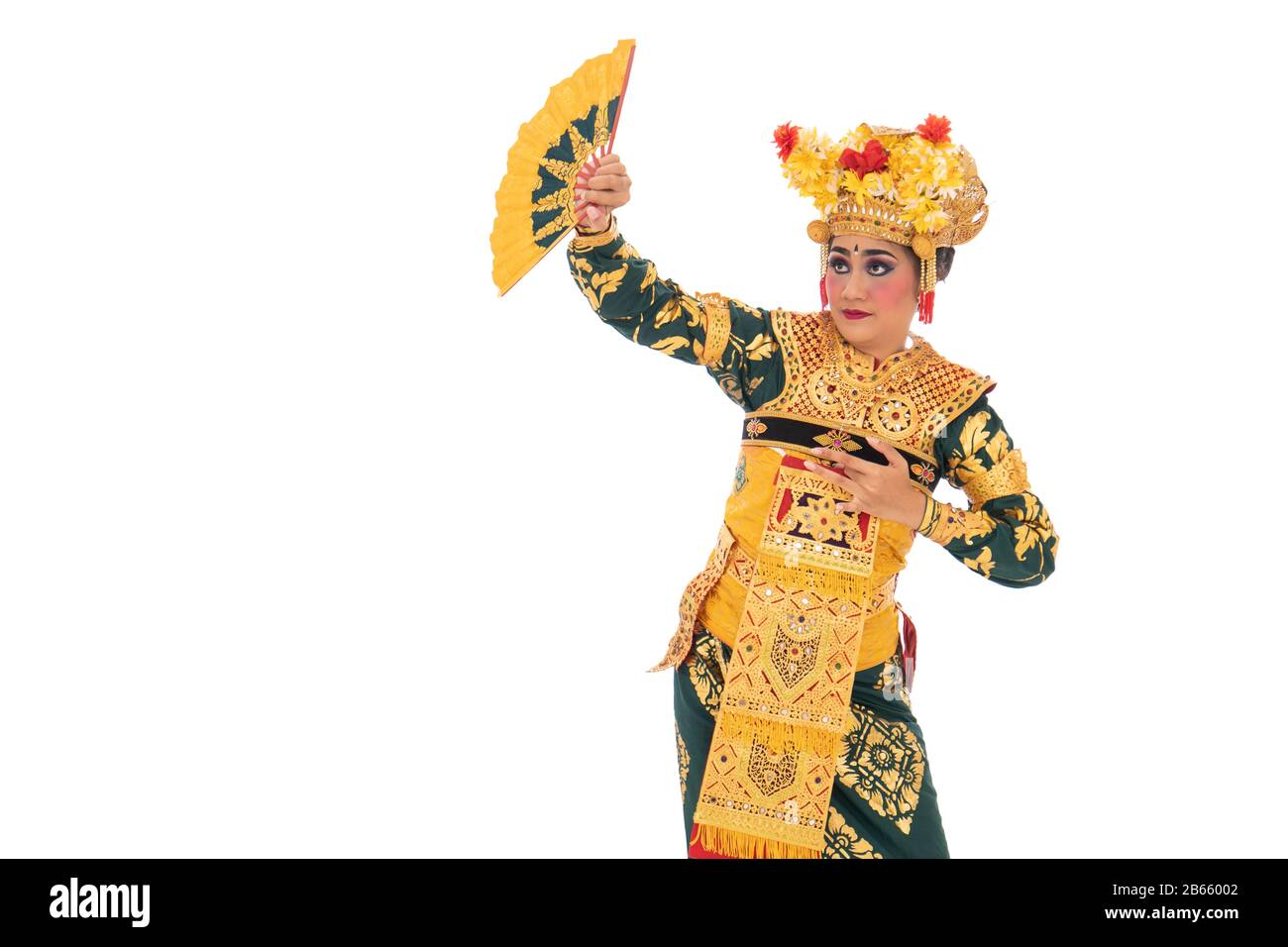 Balinese dancers hold a fan, traditional Indonesia dance culture ...