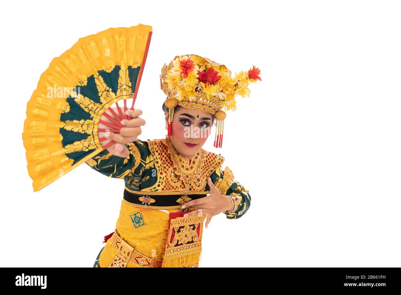 Balinese dancers hold a fan, traditional Indonesia dance culture ...