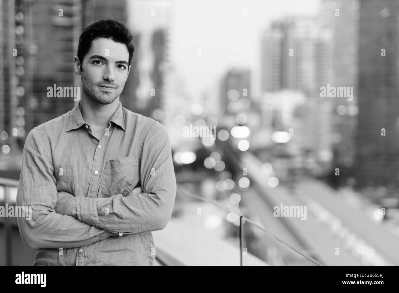 Portrait of young handsome businessman exploring the city Stock Photo ...