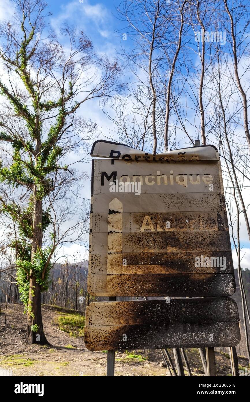 Burnt sign on the road after a forest fire in Monchique, Portugal ...