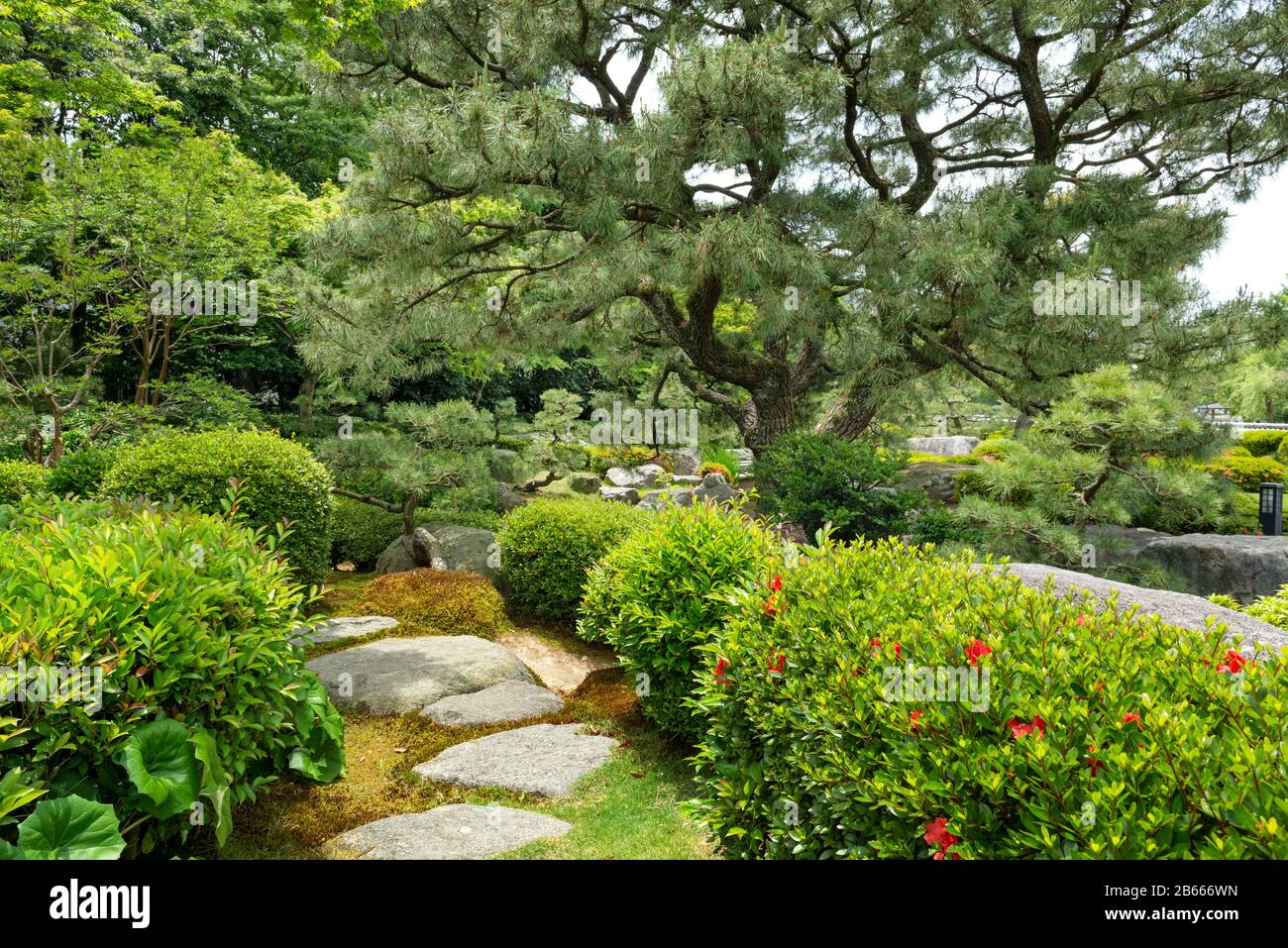 Zen scene with a stone path in a beautiful Japanese garden Stock Photo ...