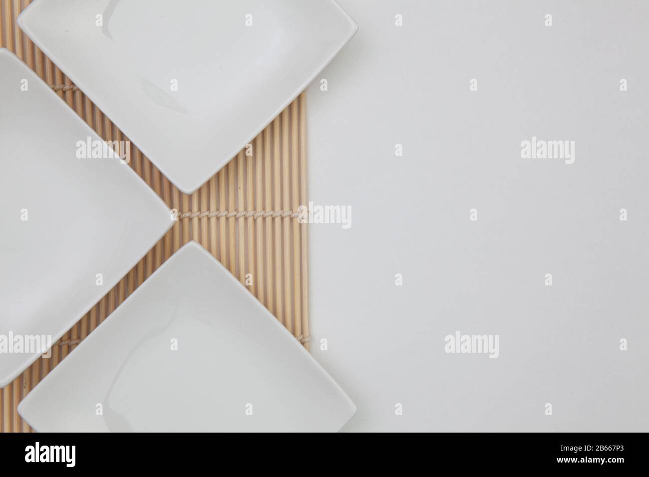 Top View Of White Empty Sushi Plates And Bamboo Mat. Food Design Stock ...