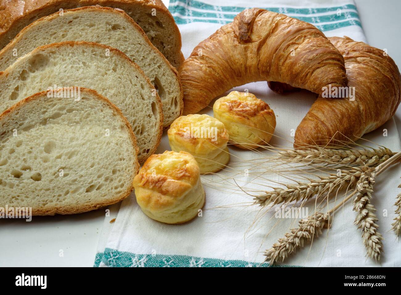 bakery with white flour on a cloth with grain on white table Stock ...