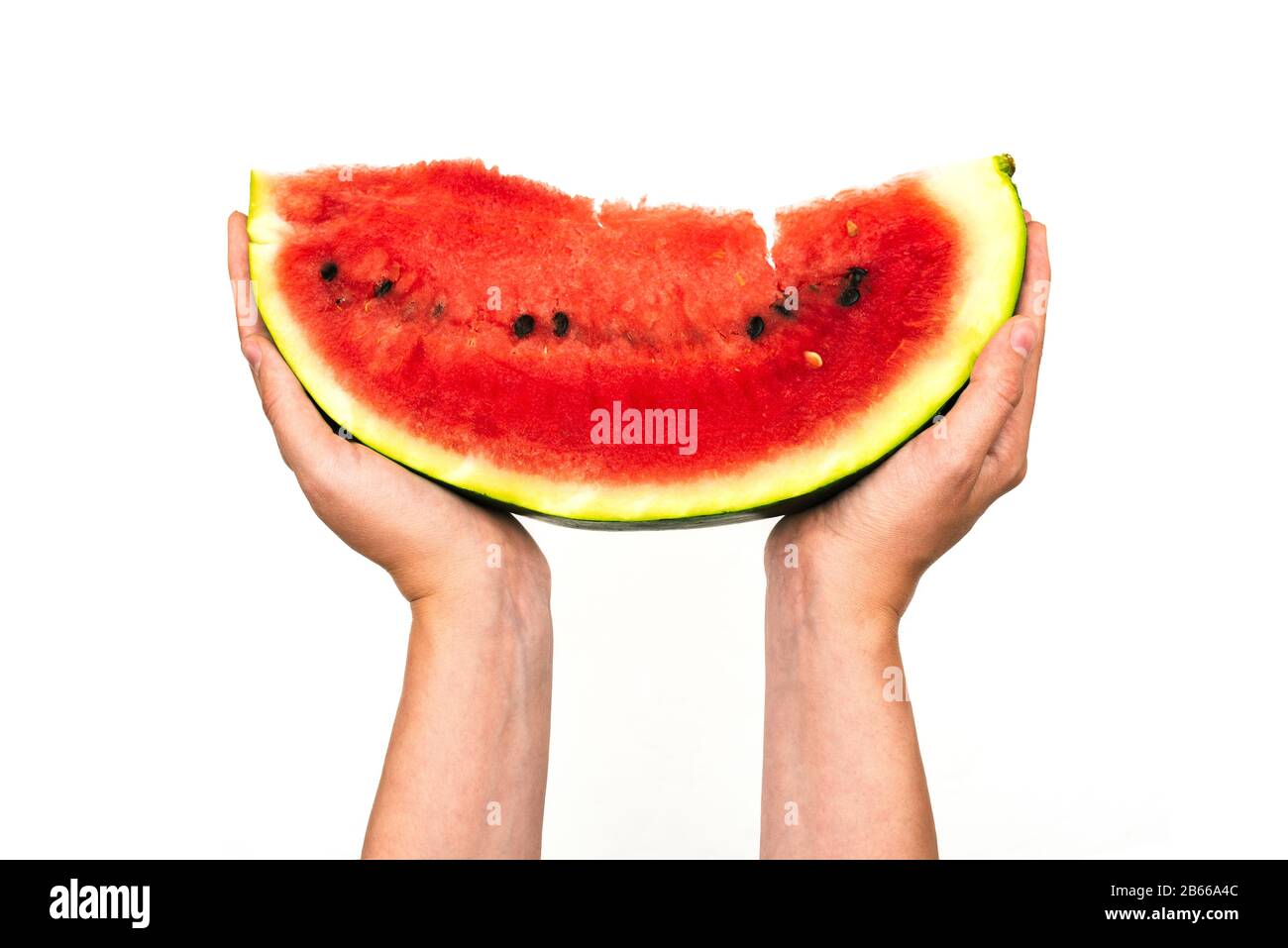 Slice of watermelon in female hands isolated on a white background ...