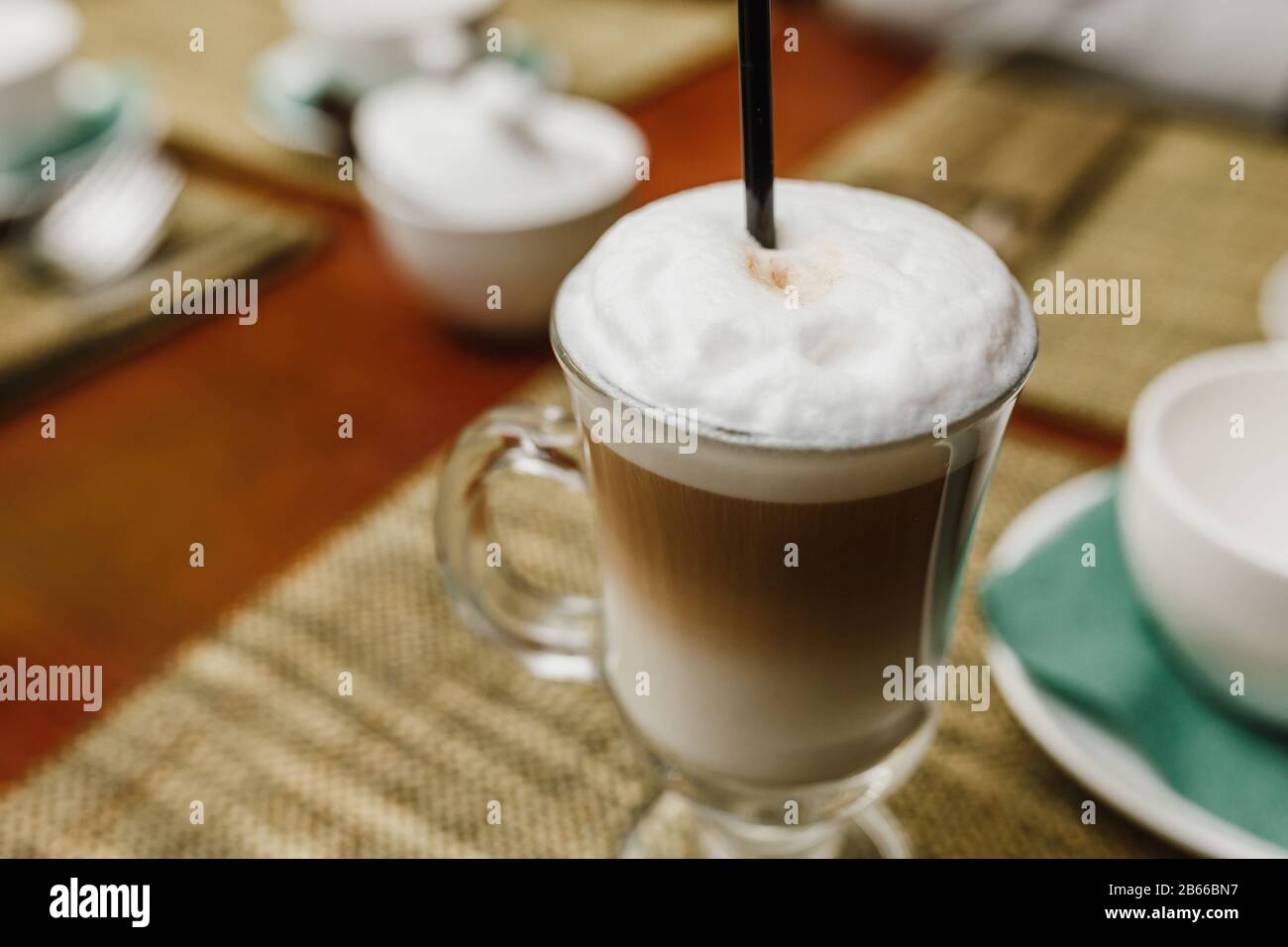 Latte on a table in a cafe Stock Photo - Alamy