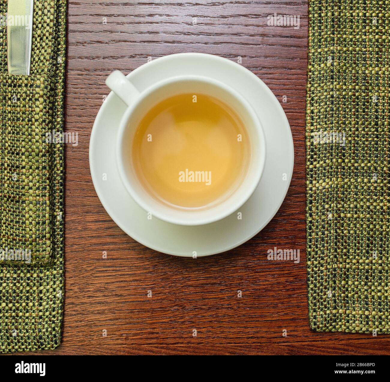 Yellow soft herbal tea in a cup in the restaurant Stock Photo - Alamy