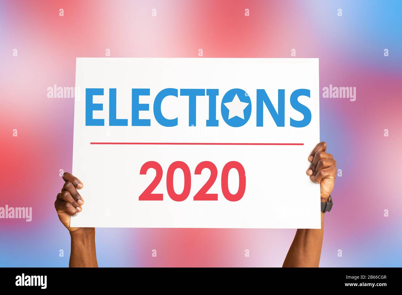 African American citizen holding sign that says ELECTIONS 2020 on ...
