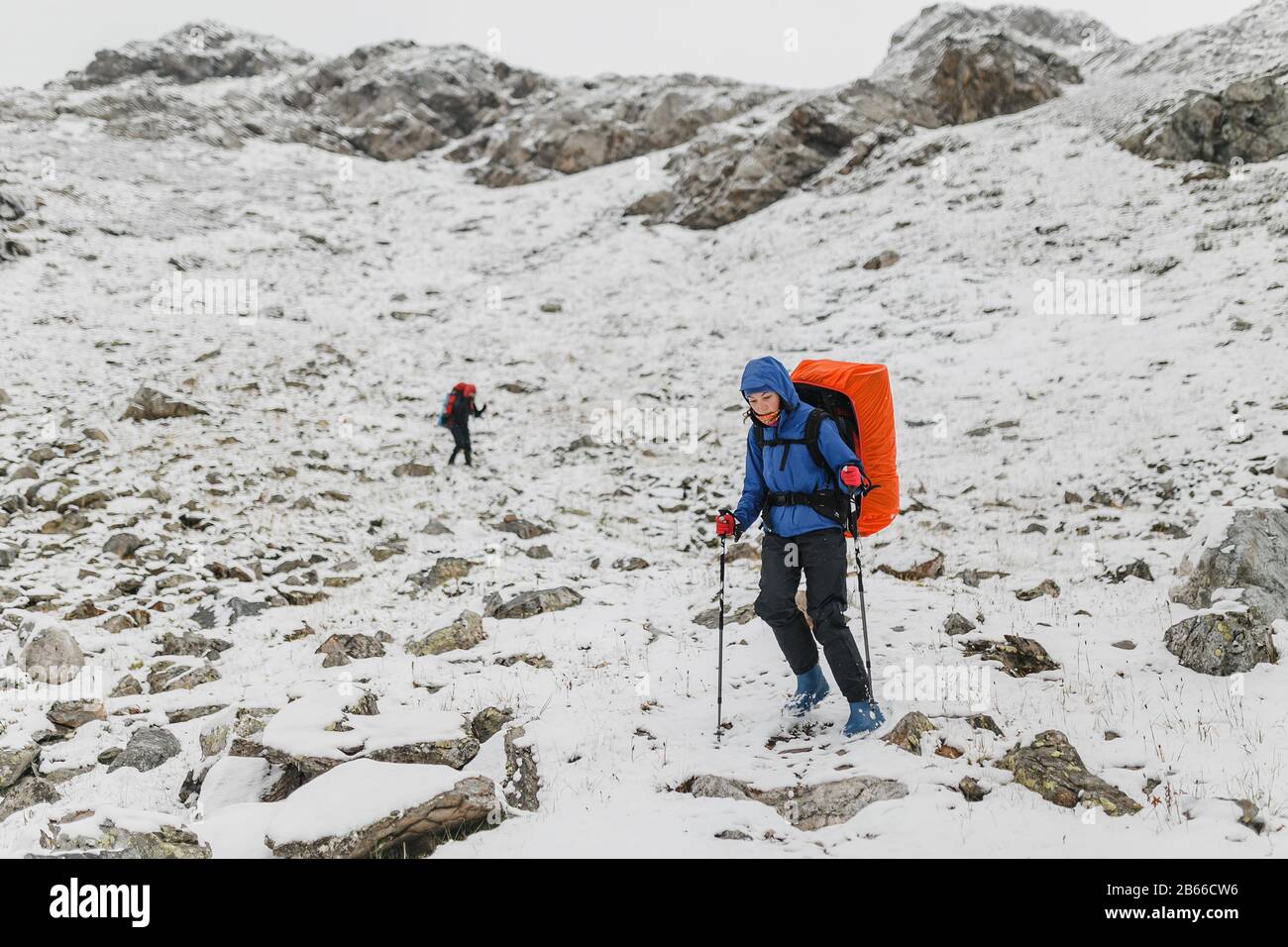 Backpacker walking on mountain slope hi-res stock photography and ...