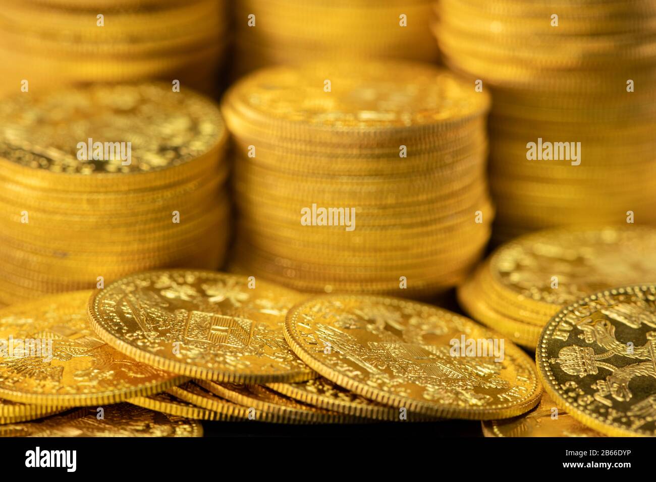 Closeup of stacks and a pile of old gold coins, black background Stock ...