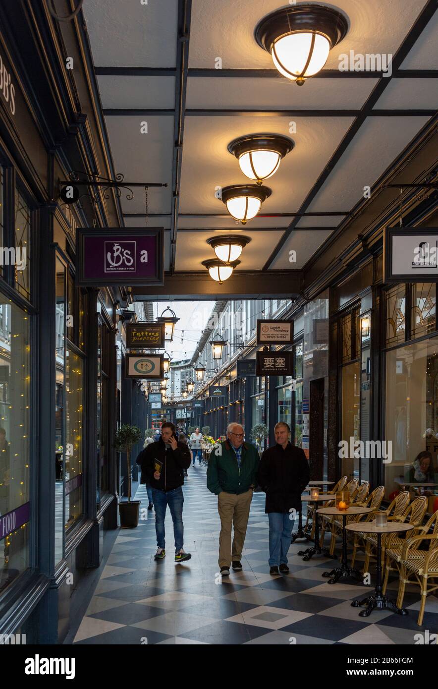 Shoppers walking in High Street arcade in city centre of Cardiff, South ...