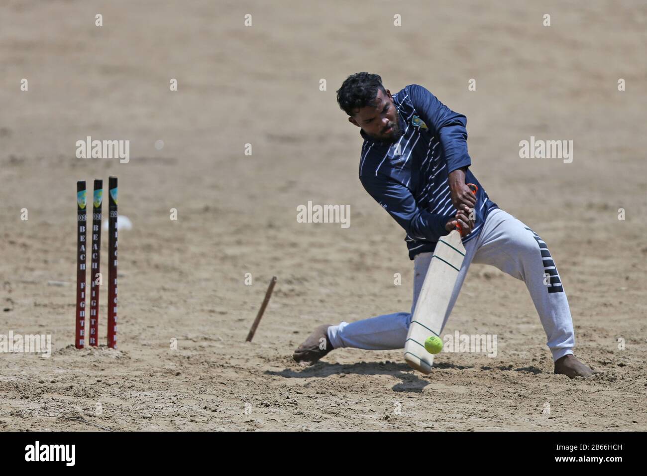 Sri Lankan Cricket Fans Play A Game Of Cricket On The Beach At Galle 
