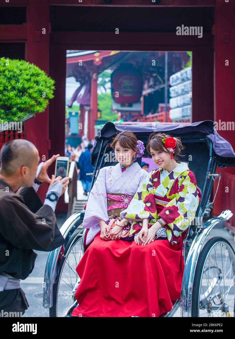 Japanese women with traditional Kimono riding Rickshaw in Tokyo Japan ...