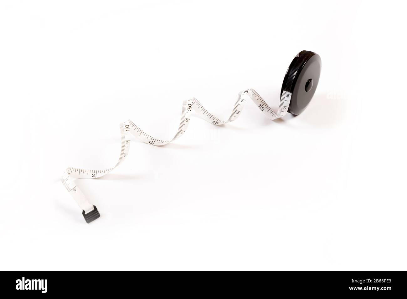 Measuring tape on white background. Tape measure on a roll Stock Photo ...