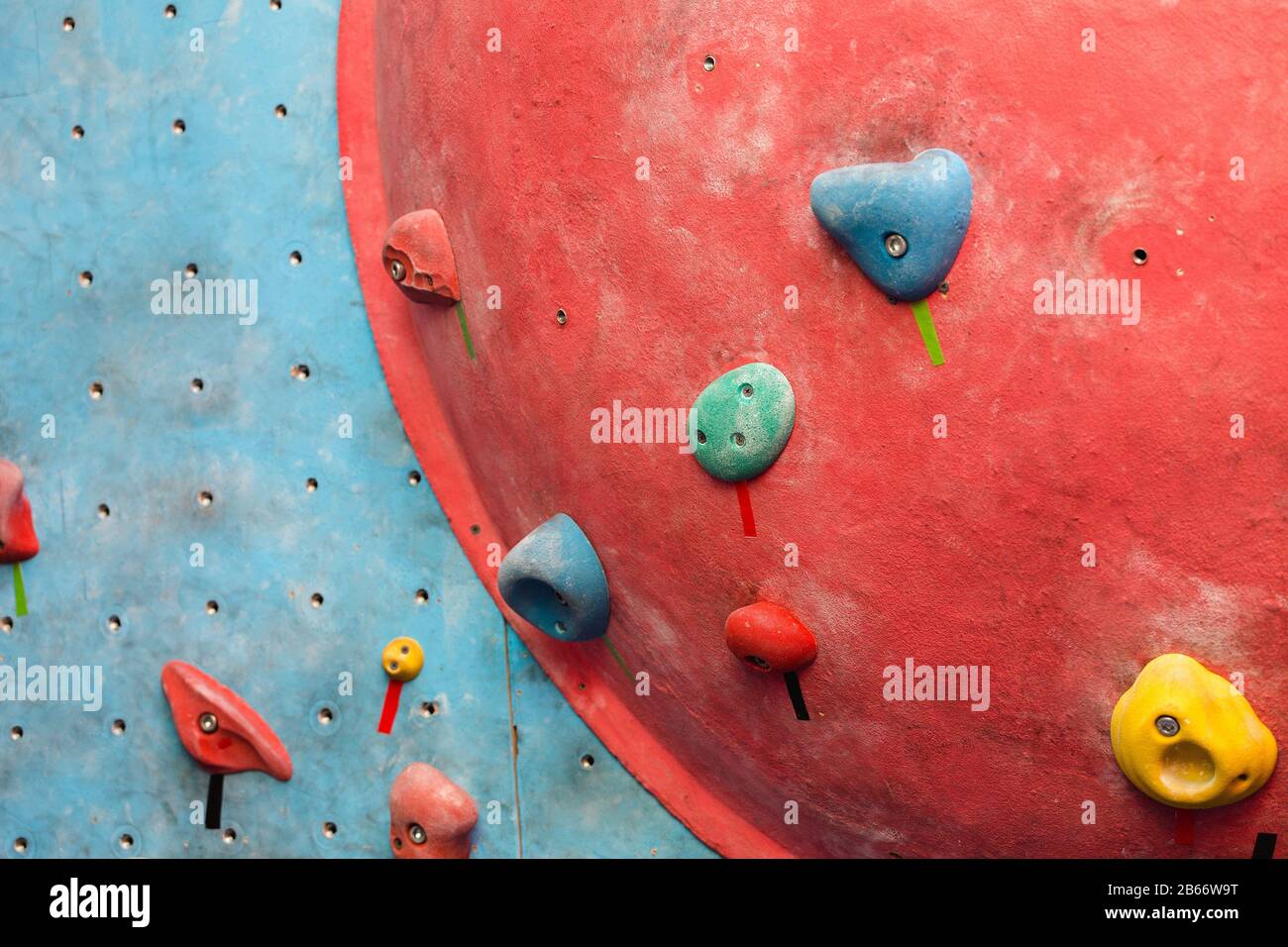 Artificial climbing wall in an indoor climbing gym with spherical ...