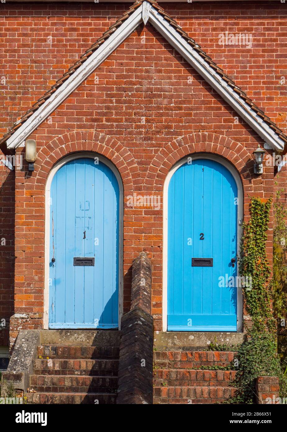 A pair of blue country cottage front doors, West Sussex UK Stock Photo ...