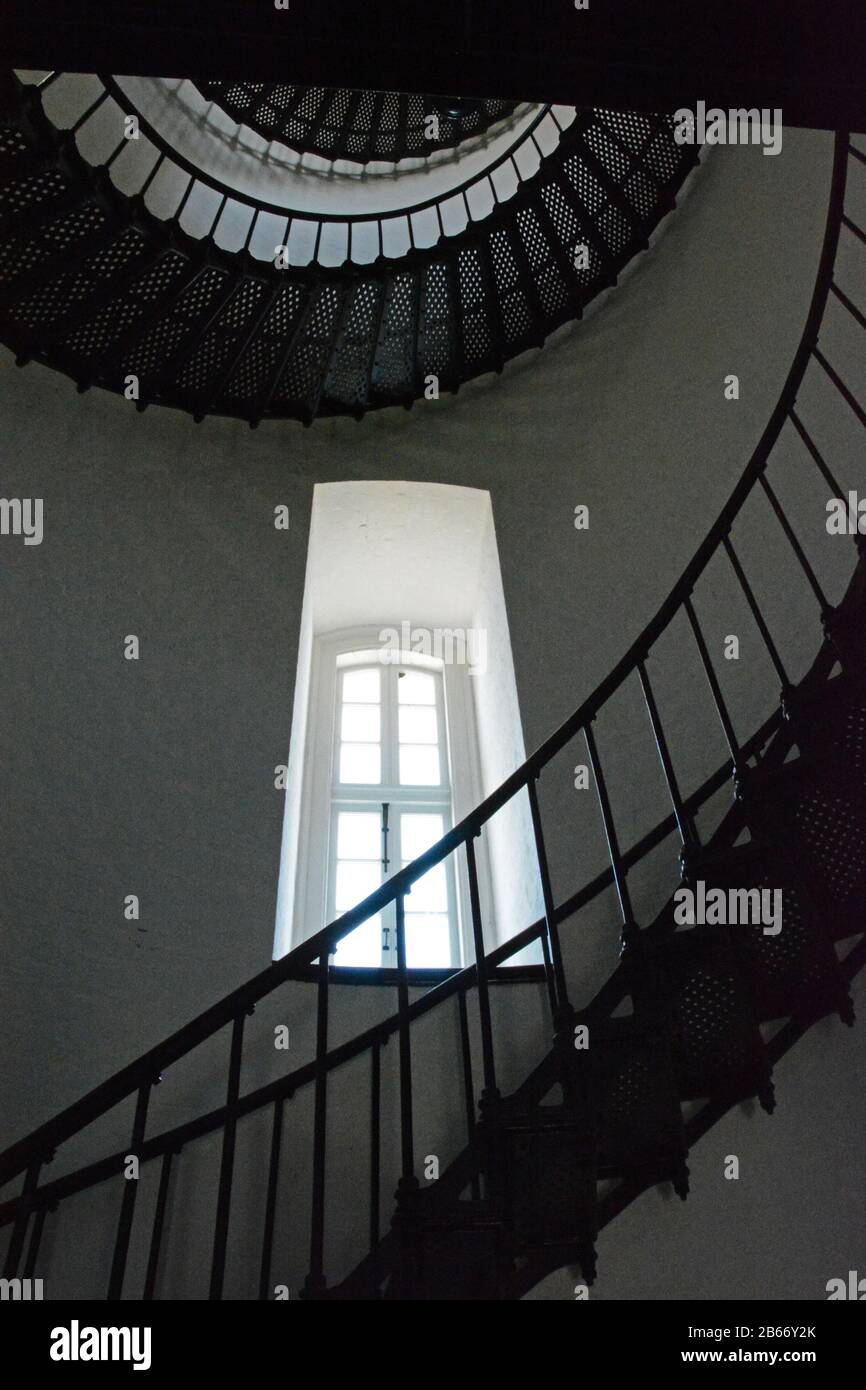 Light streams in through a window of the interior stairwell of the ...