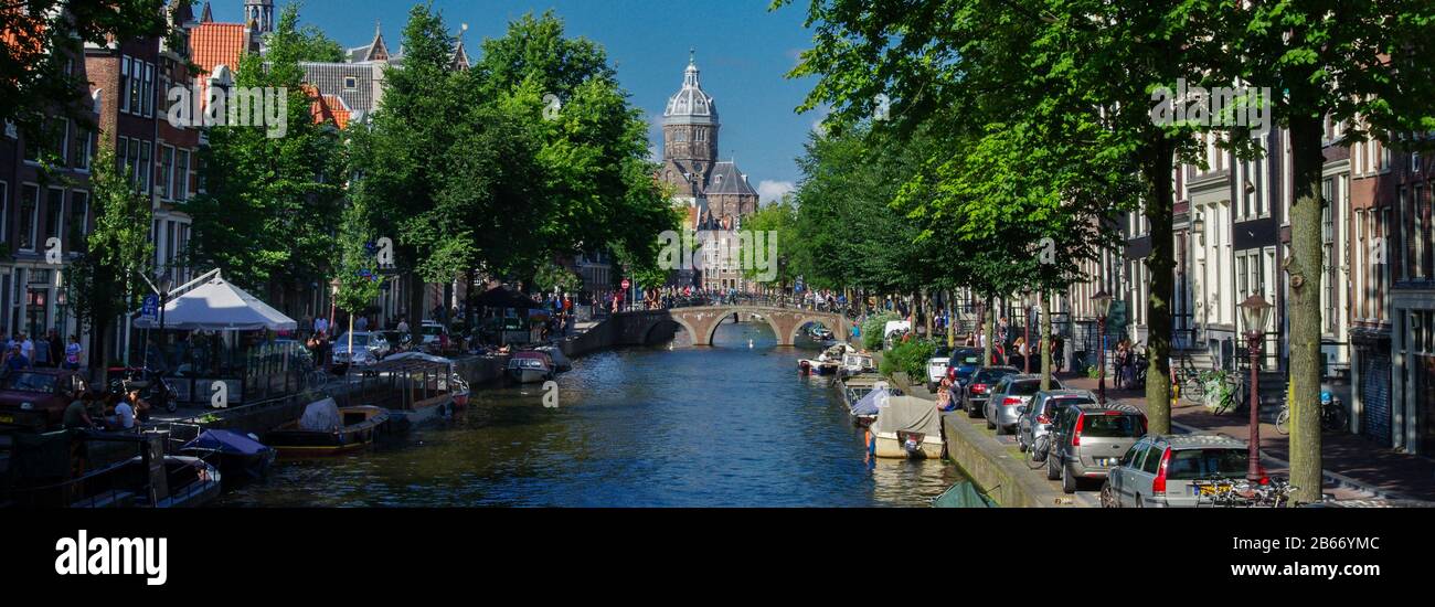 Amsterdam Urban Landscape with canal, church and dome / Basilica of ...