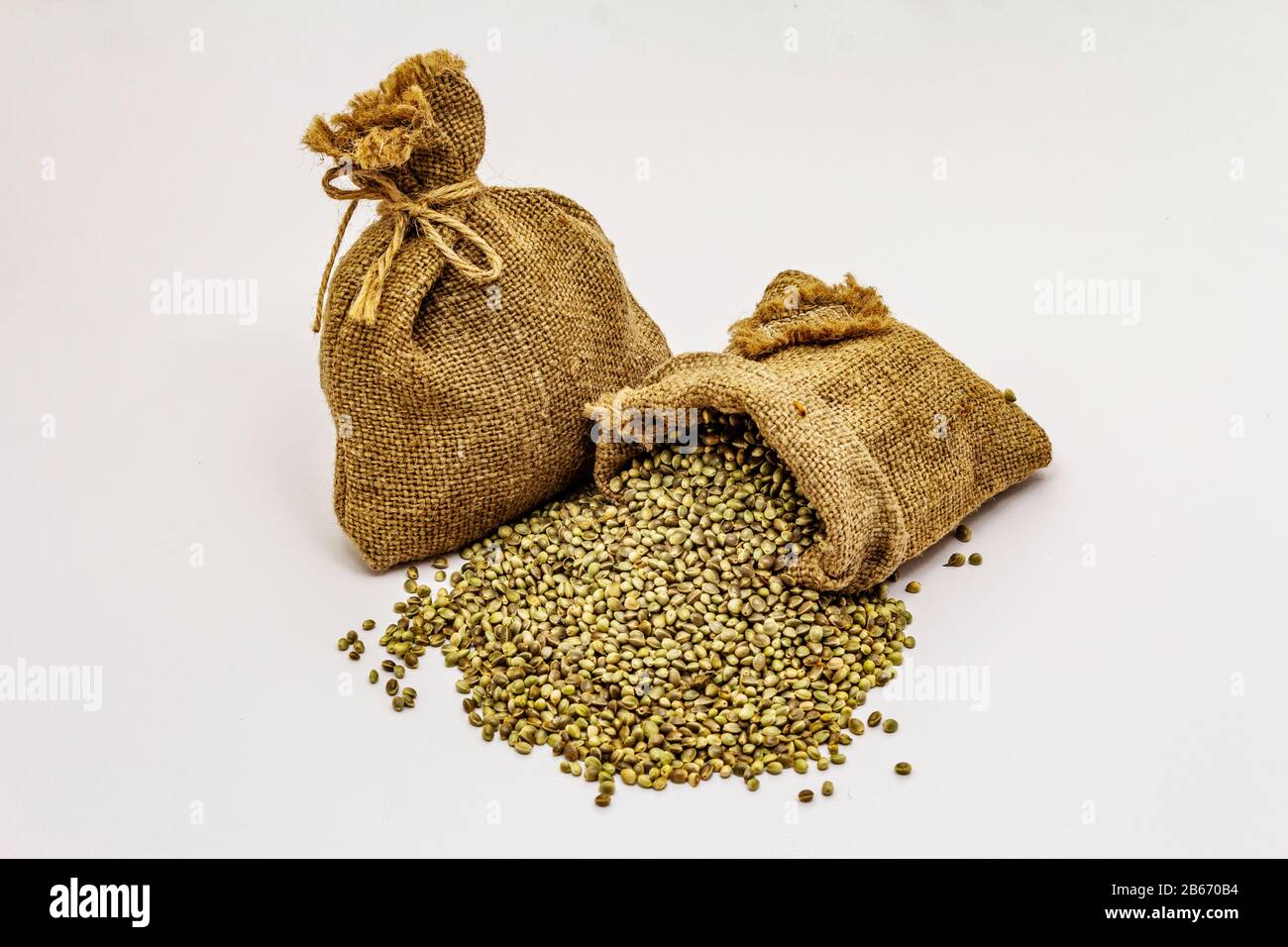 Ripe hemp seeds in bag isolated on white background. Trend food ...