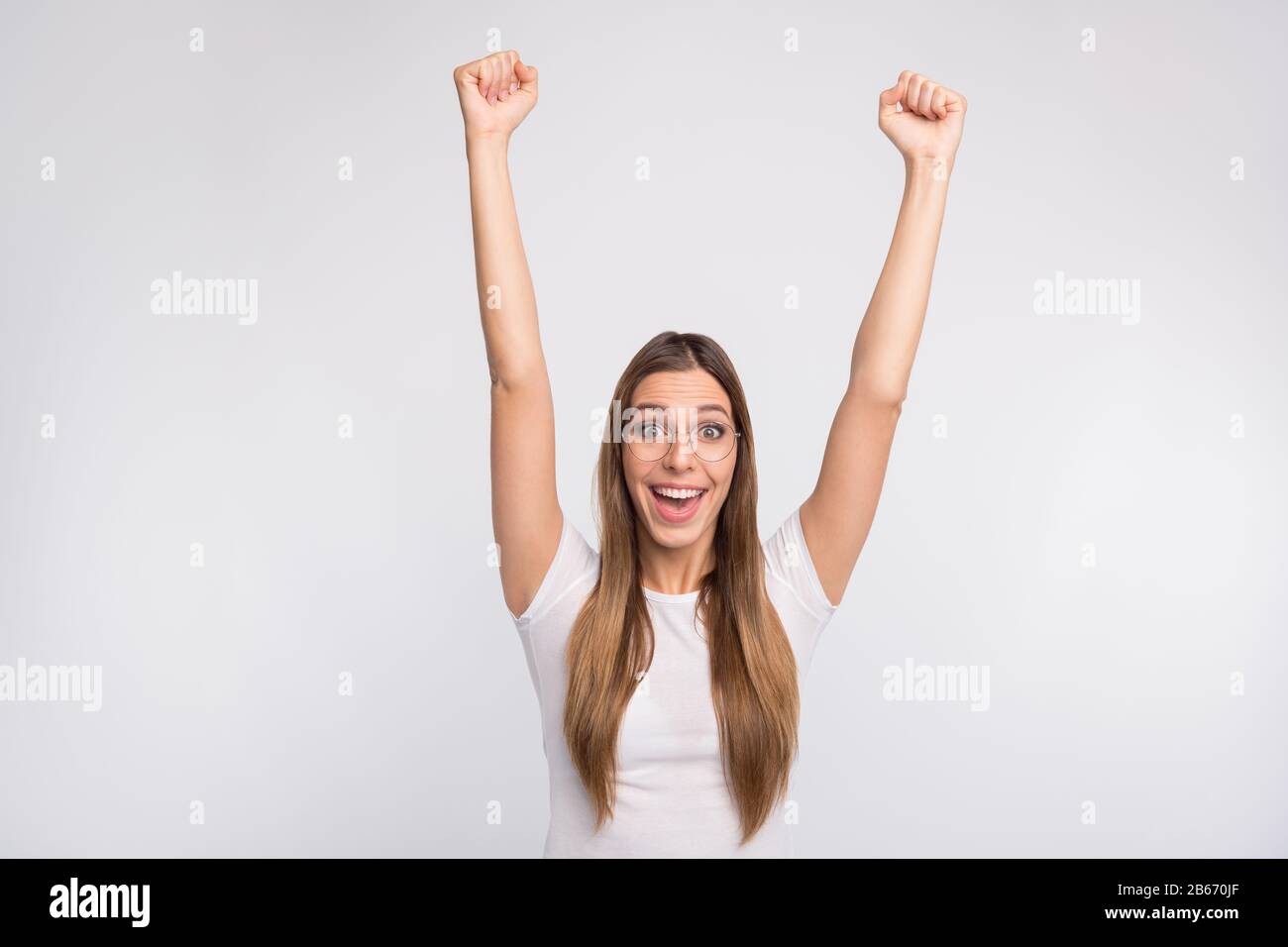 Funny lady support favorite team raising arms up wear specs and casual ...
