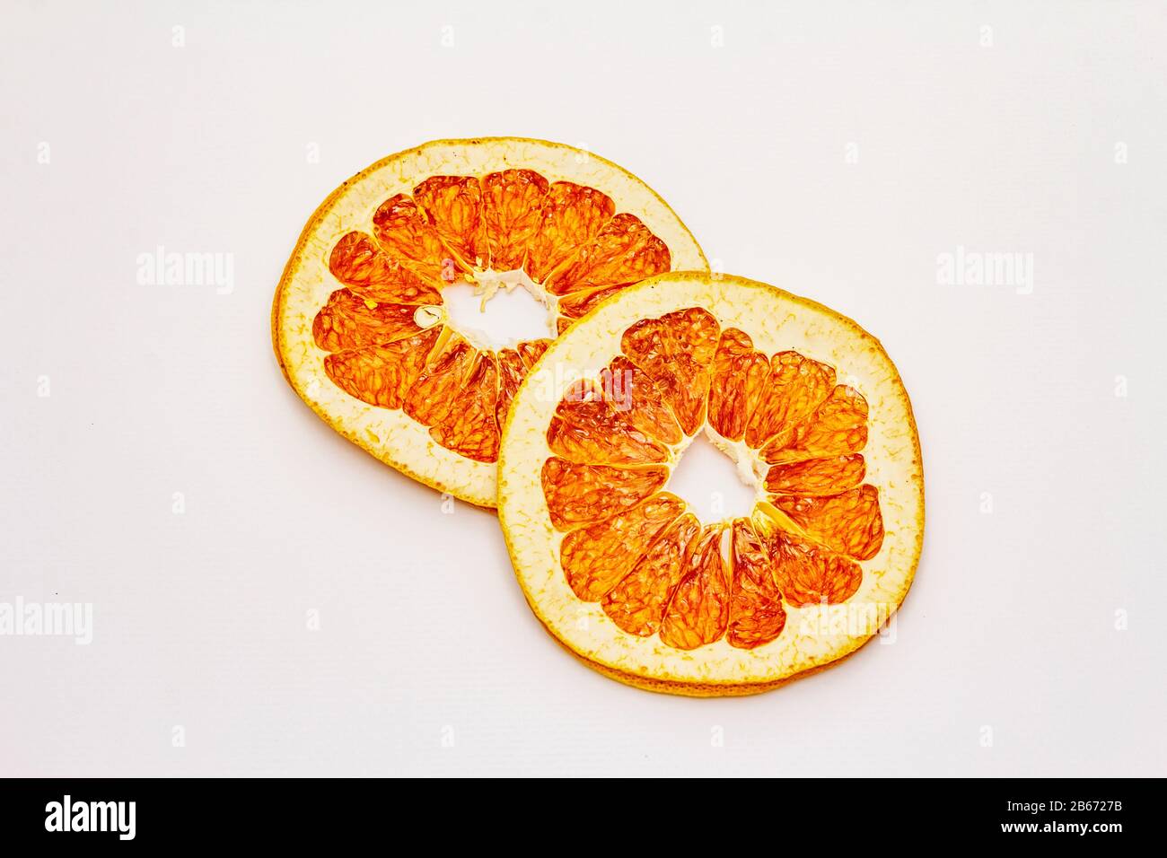 Dried slices of grapefruit isolated on white background. Healthy eating ...