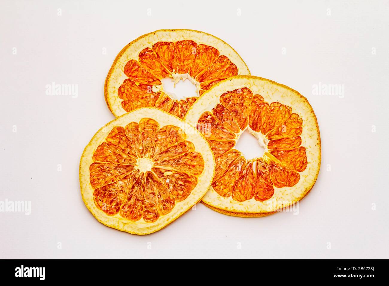Dried slices of grapefruit isolated on white background. Healthy eating ...
