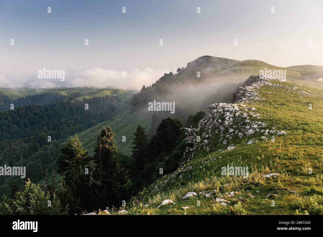 Square landscape of the Caucasus Mountains to the forest and misty ...