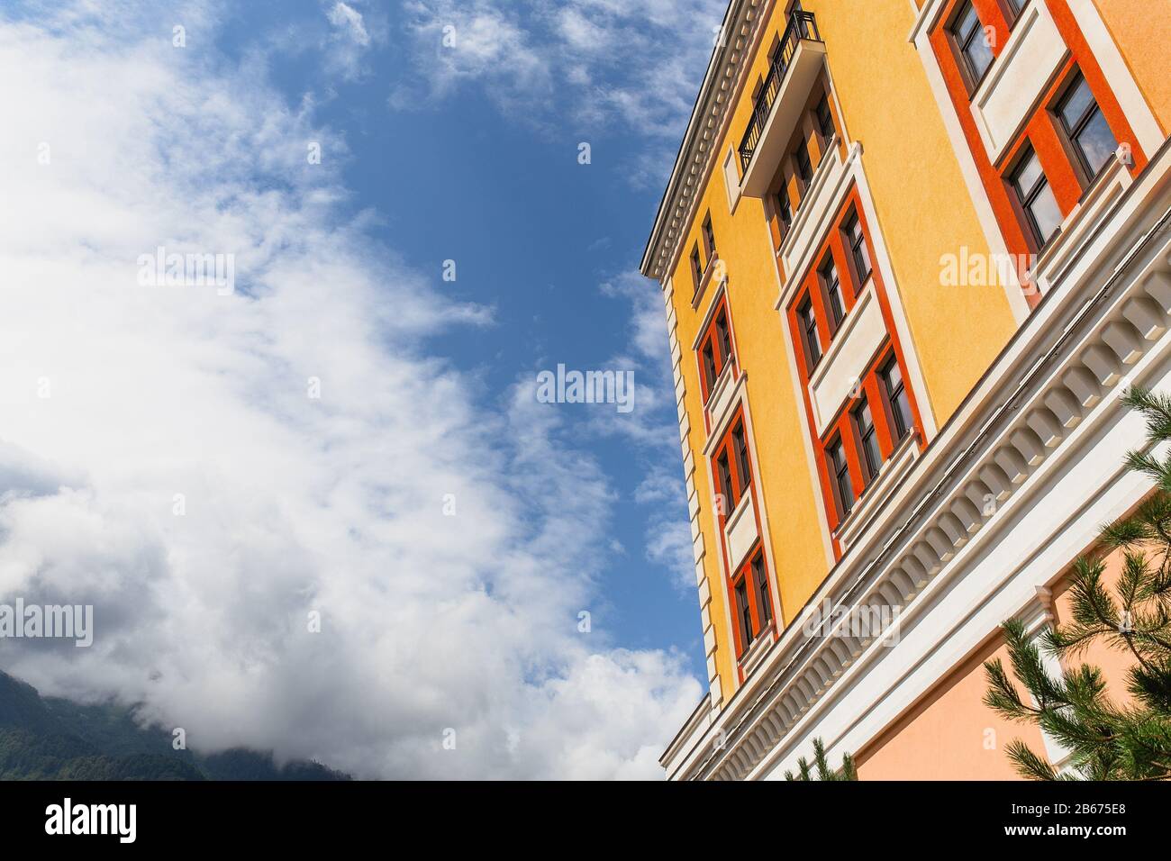 Modern exterior of a colorful hotel building on the sky background ...