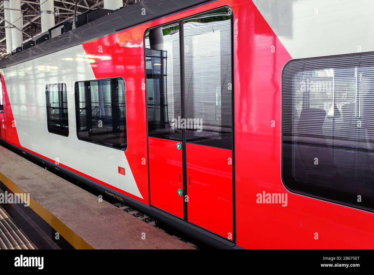 Modern red train doors Stock Photo - Alamy