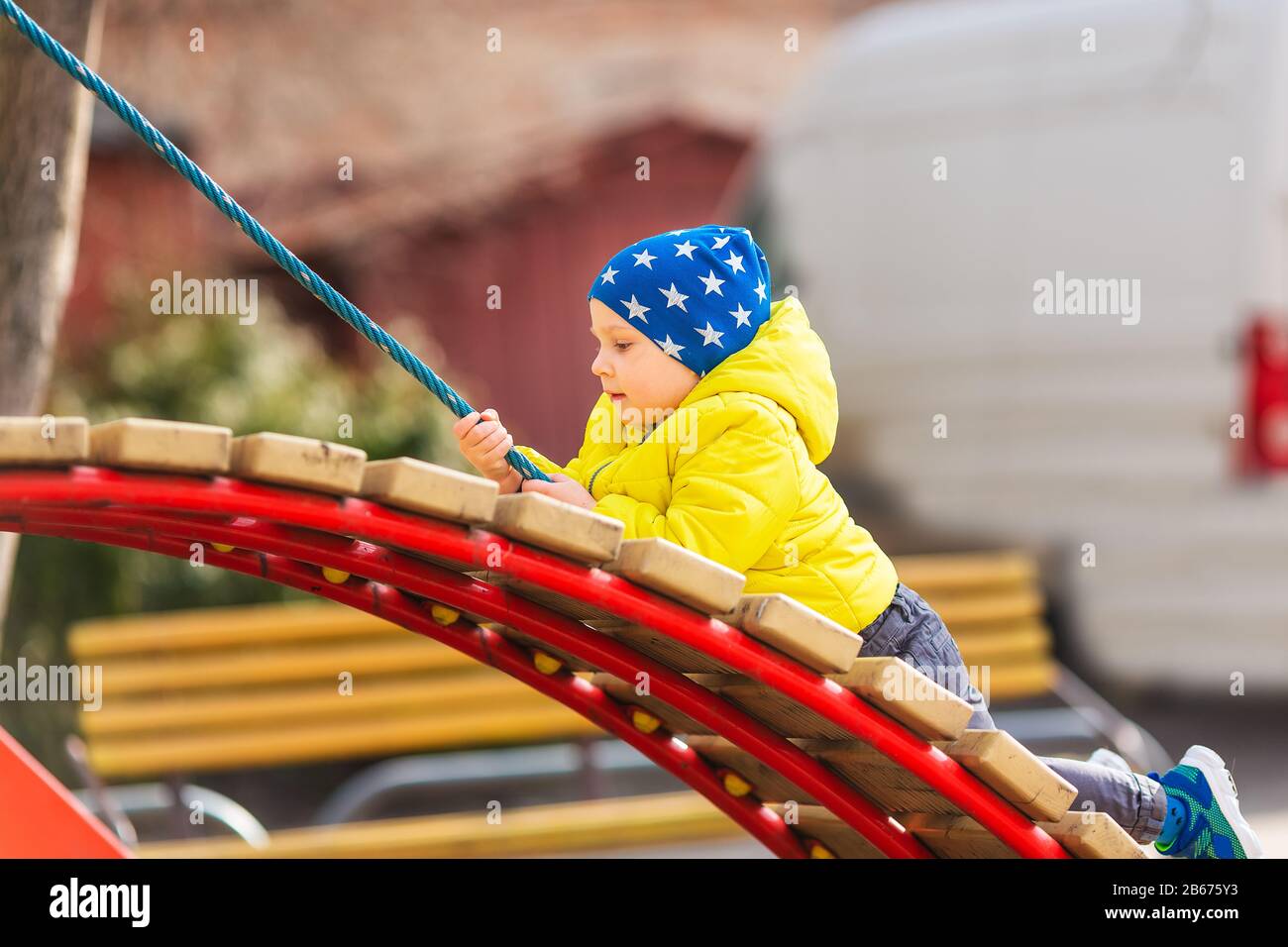 Happy little baby boy playing on the playground outdoor Stock Photo - Alamy