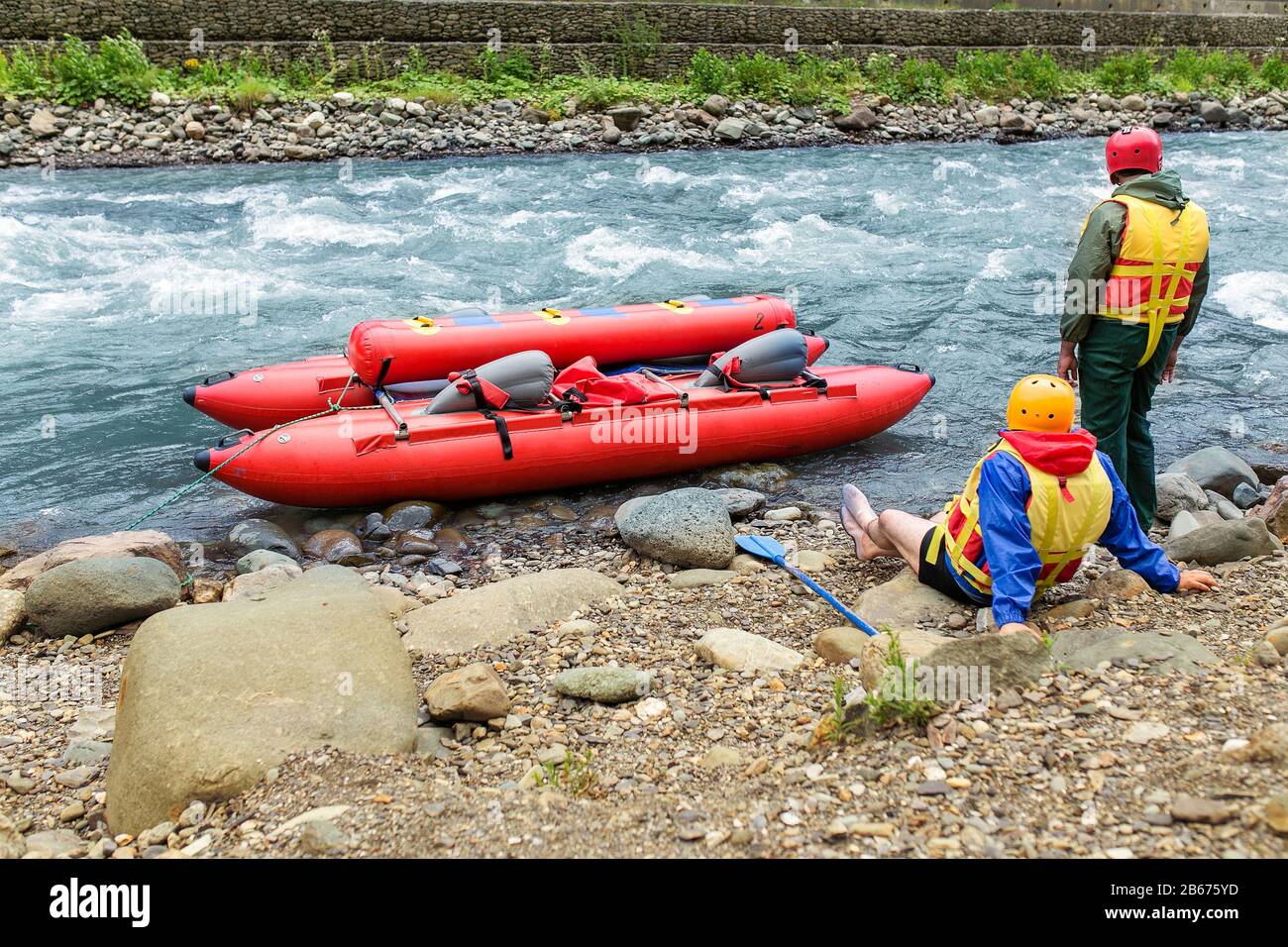 Man rowing inflatable boat hi-res stock photography and images - Alamy