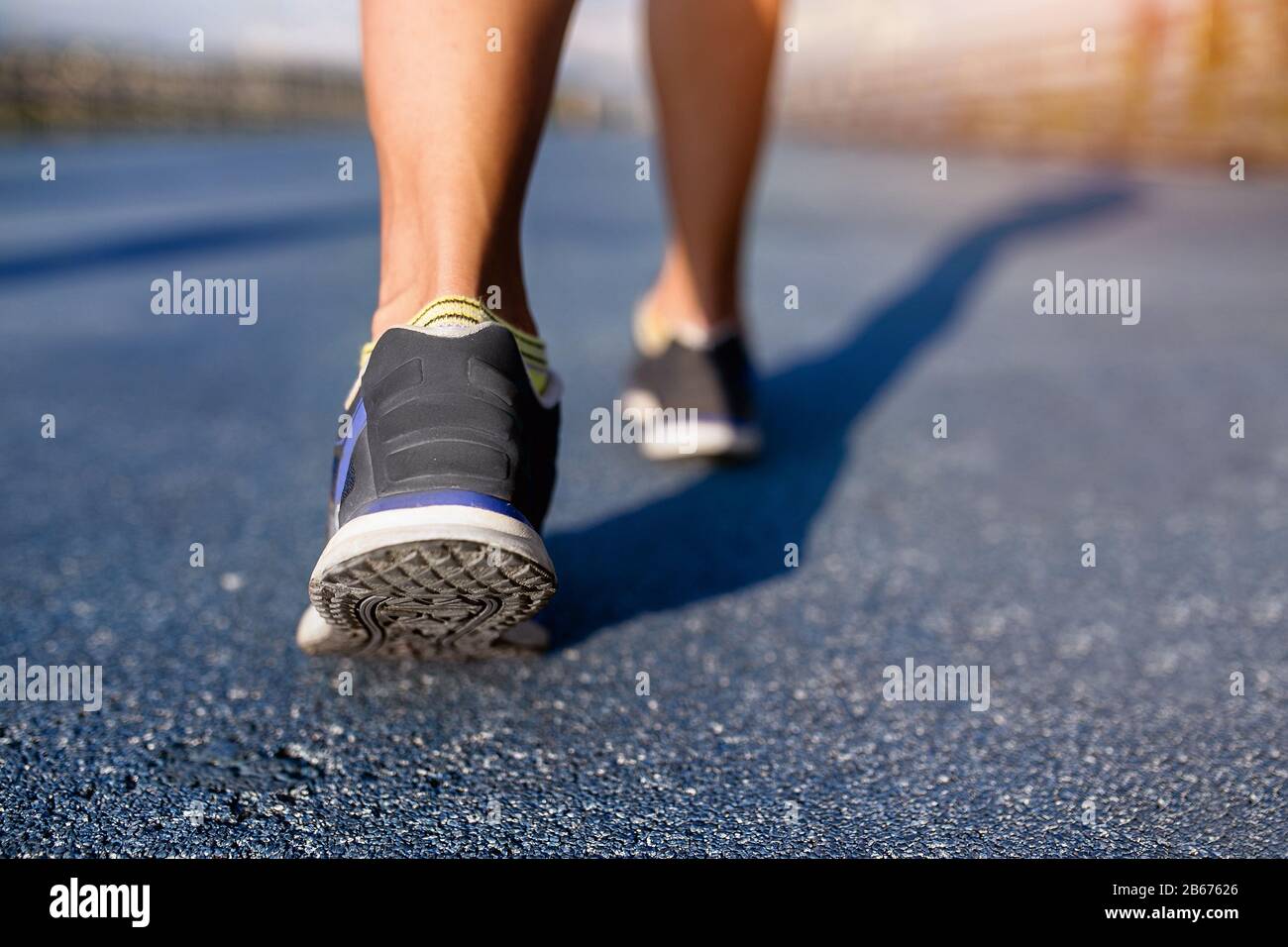Woman muscle runner feet on road closeup on shoe Stock Photo - Alamy