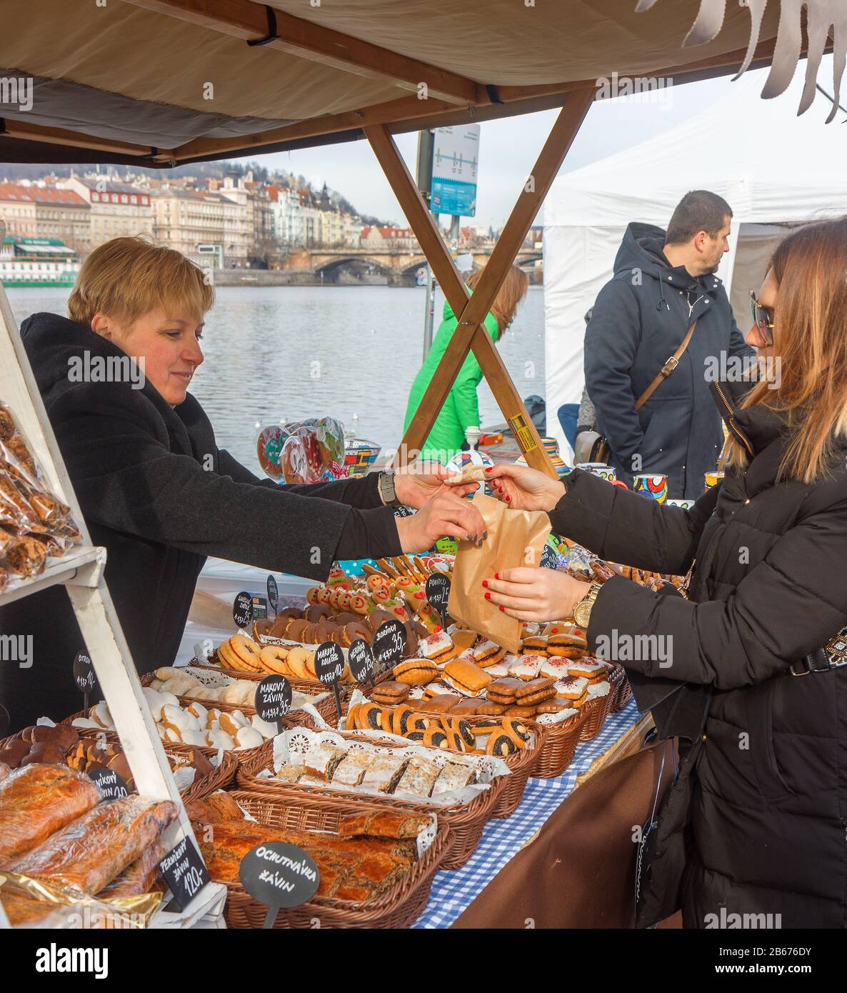 PRAGUE - February 15: Vendor sells ginger bread in her stall at ...
